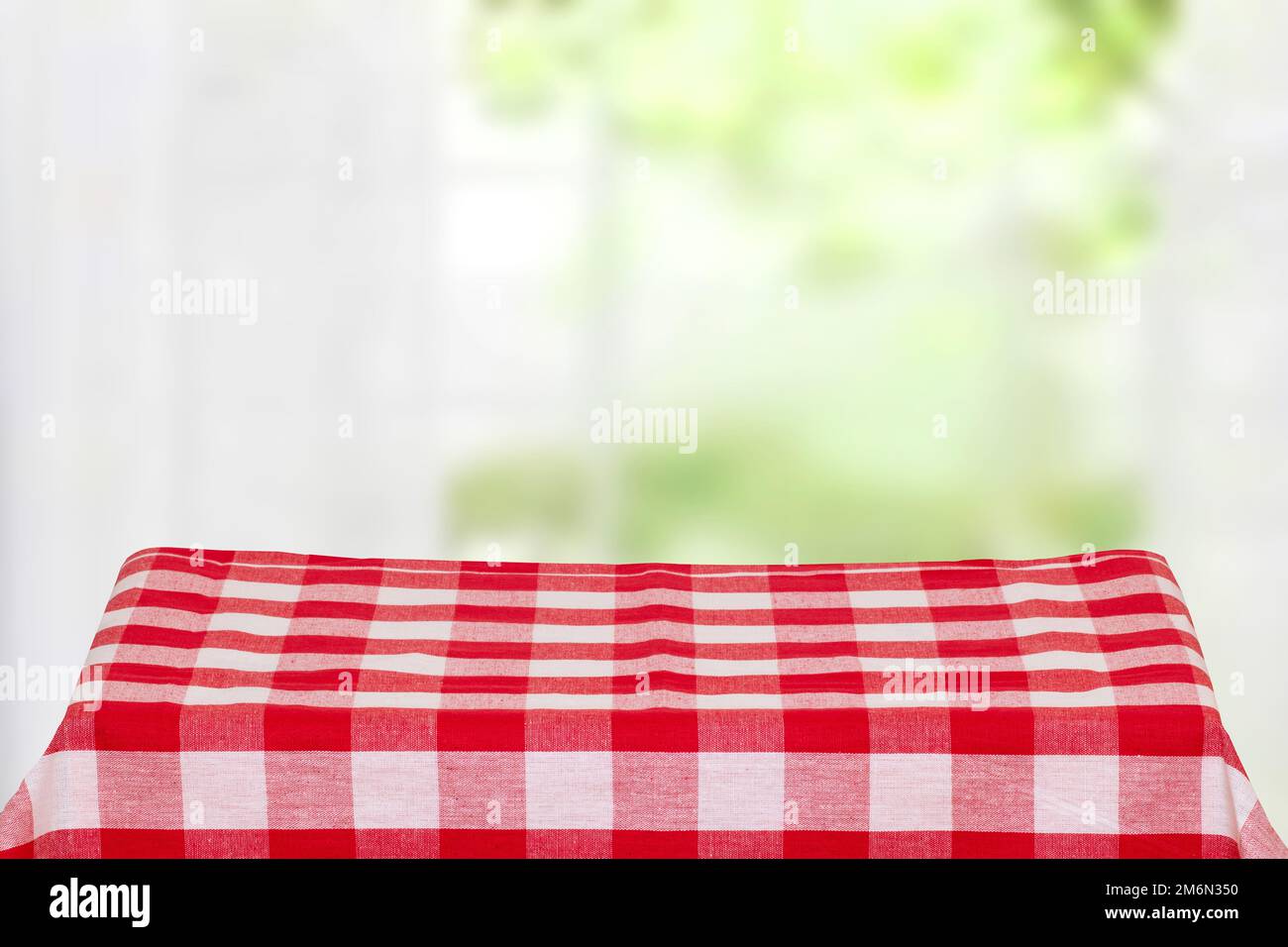 Empty table product. Closeup of a empty red checkered tablecloth or ...