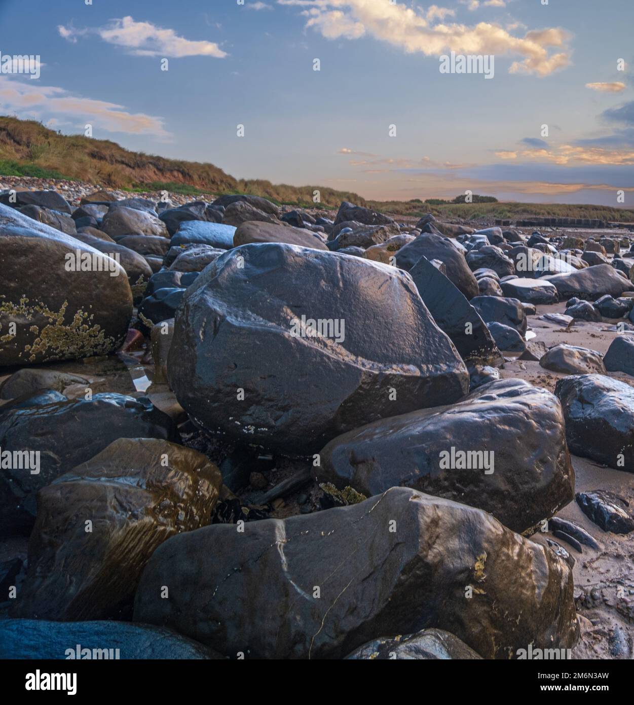 The stacks of rocks in different shapes and sizes on the beach Stock ...
