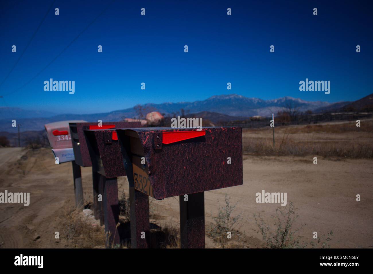 The old roadside mailboxes under a blue sky Stock Photo - Alamy