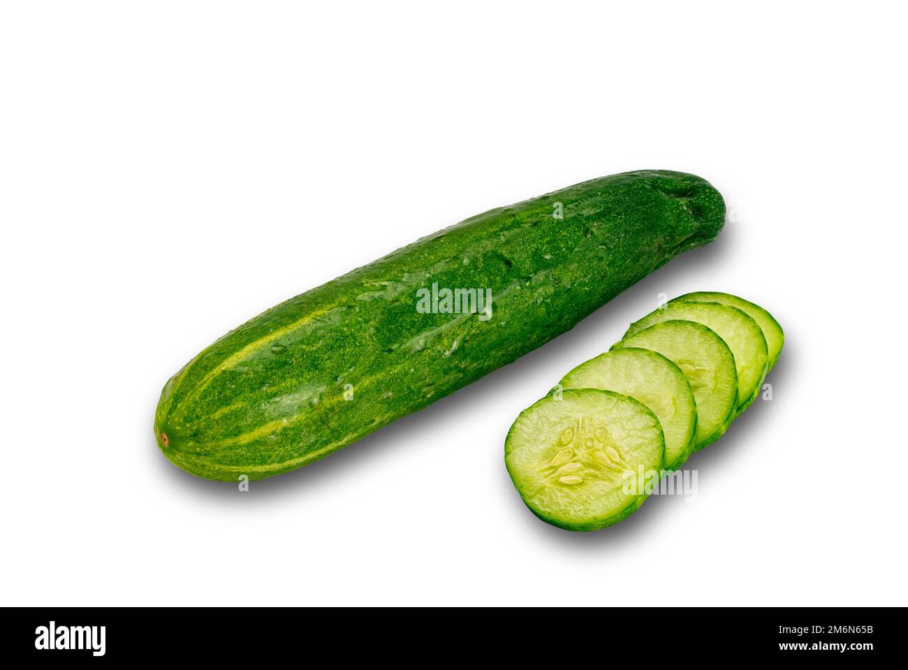 Fresh green cucumber whole and sliced isolated on white background ...