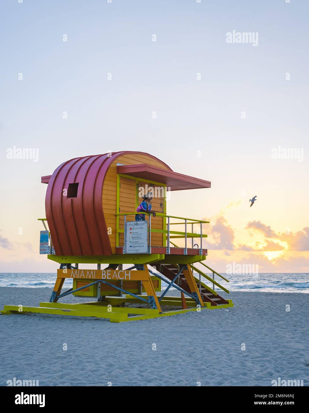 Miami beach, couple on the beach at Miami beach, life guard hut Miami ...
