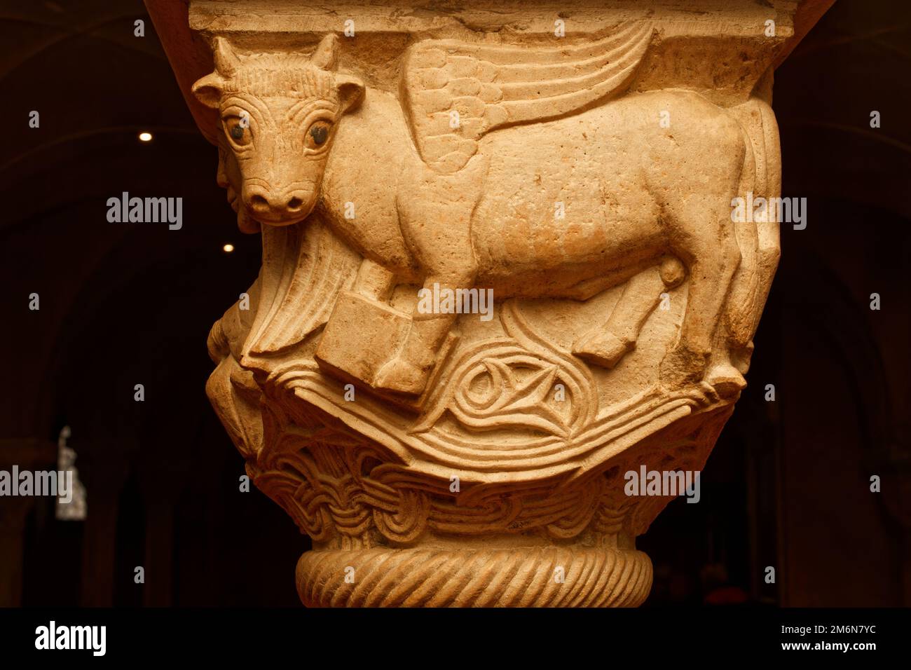 Winged bull, symbol of Saint Luke, detail of the capital in the crypt ...