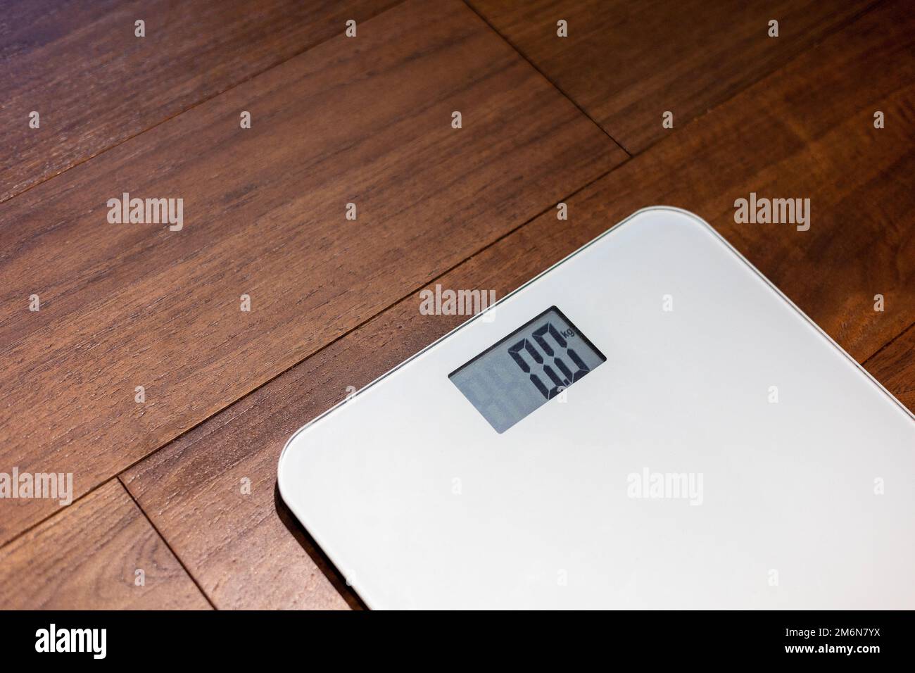 White scale with the number 0 on the ground Stock Photo - Alamy