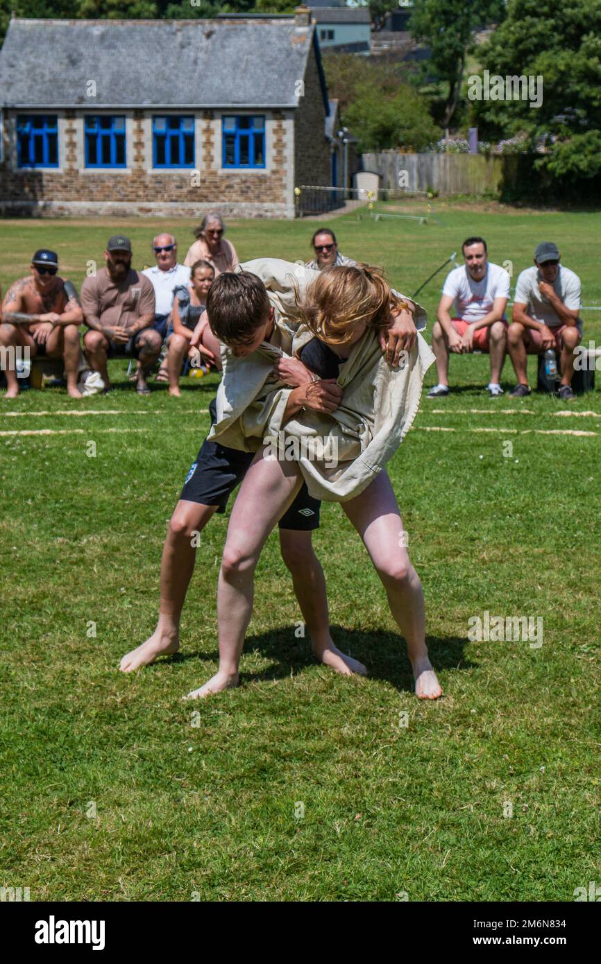A young teenage girl wrestling with a boy competing in the Grand ...