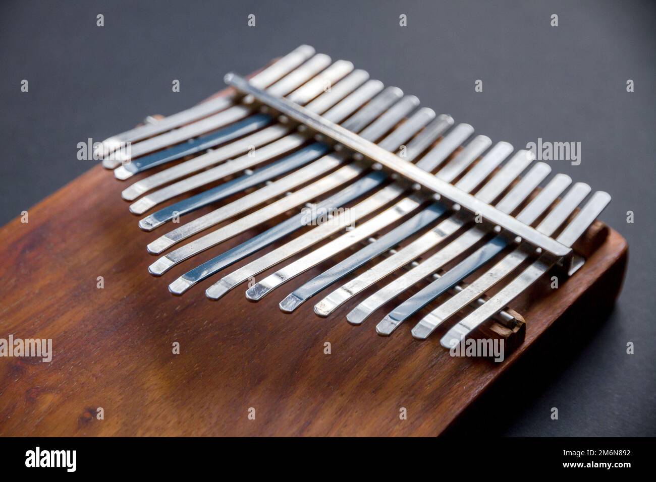 Traditional wooden kalimba isolated on black Stock Photo - Alamy