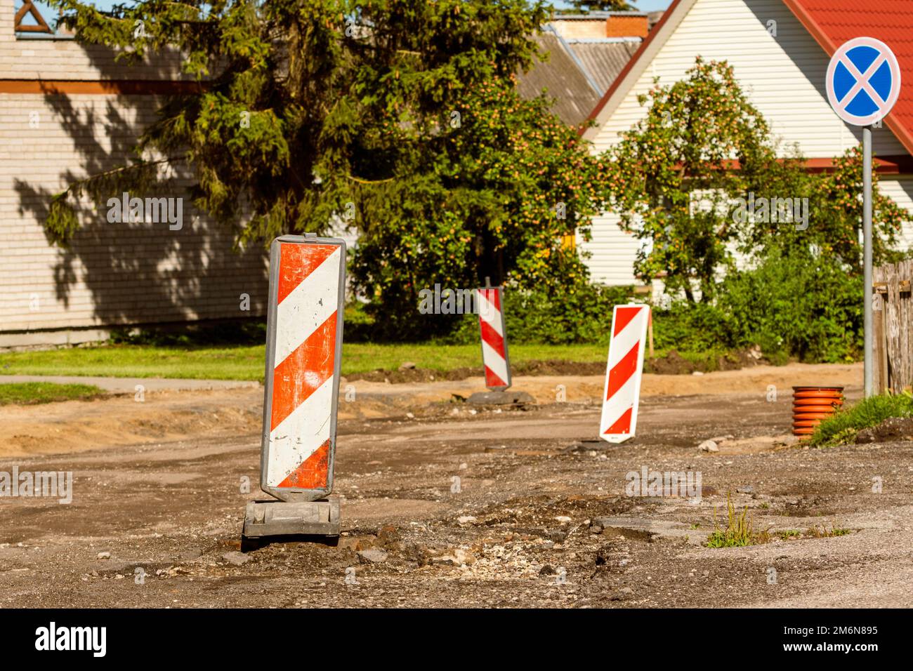 Red and white striped traffic control devices for avoiding sections of ...