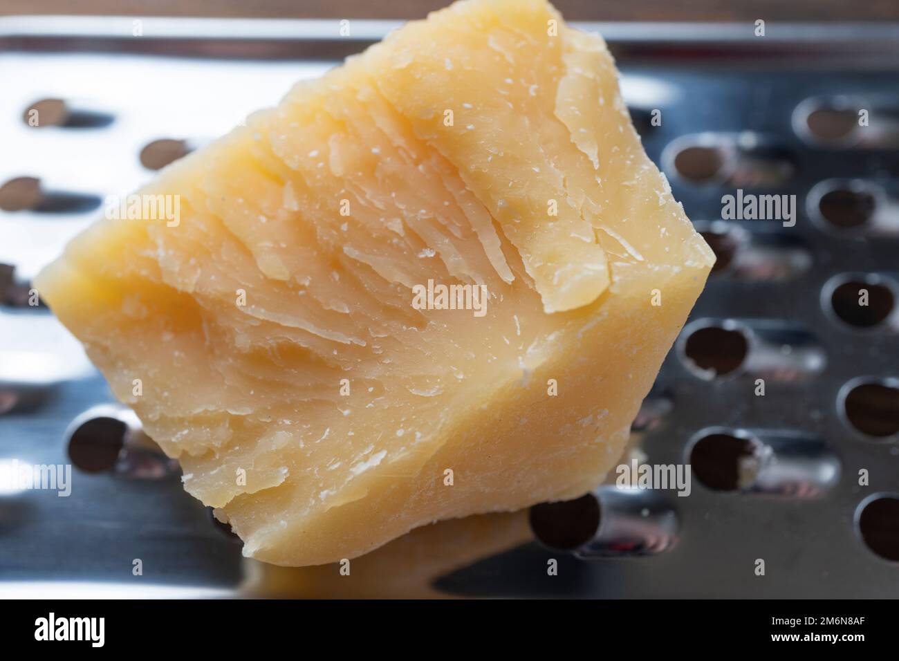 Close-up of a piece of parmesan. Hard cheese, food Stock Photo - Alamy