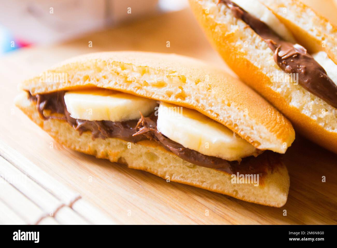 Dorayaki with nutella and banana. Dorayaki consists of two round-shaped ...