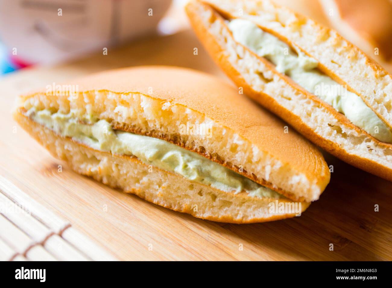 Dorayaki with matcha tea cream. Dorayaki consists of two round-shaped ...