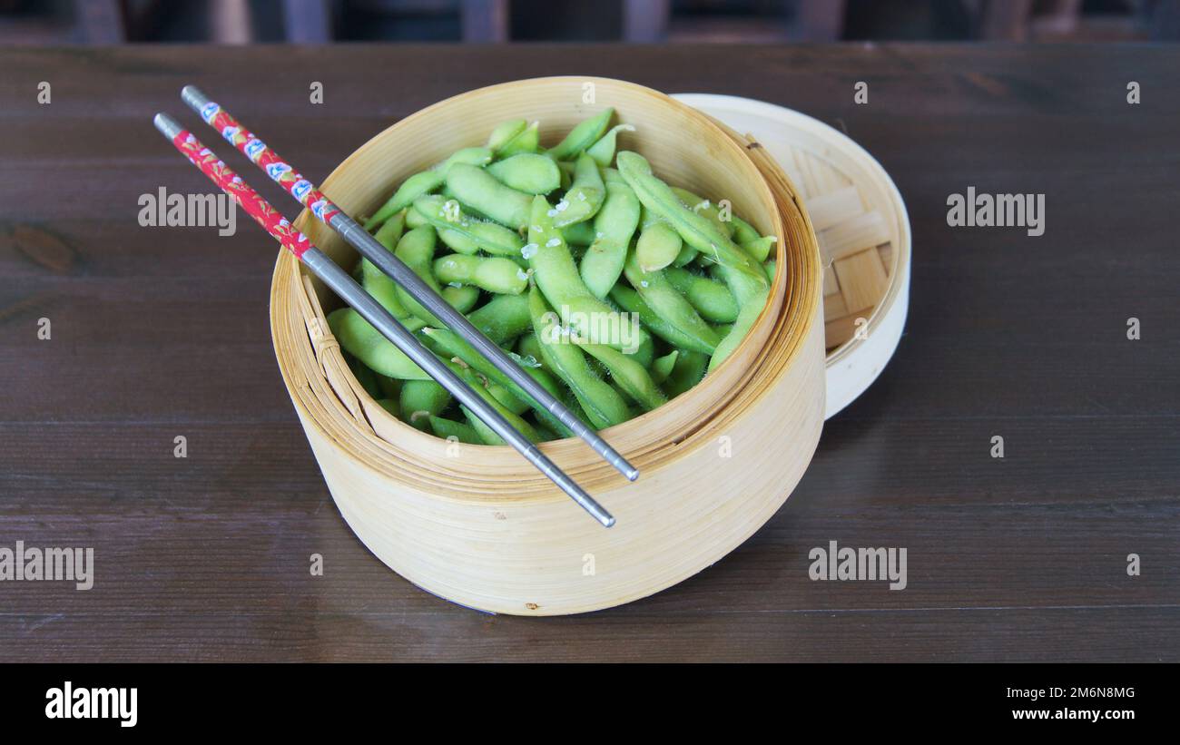 Edamame is a preparation of immature soybeans in the pod, found in ...