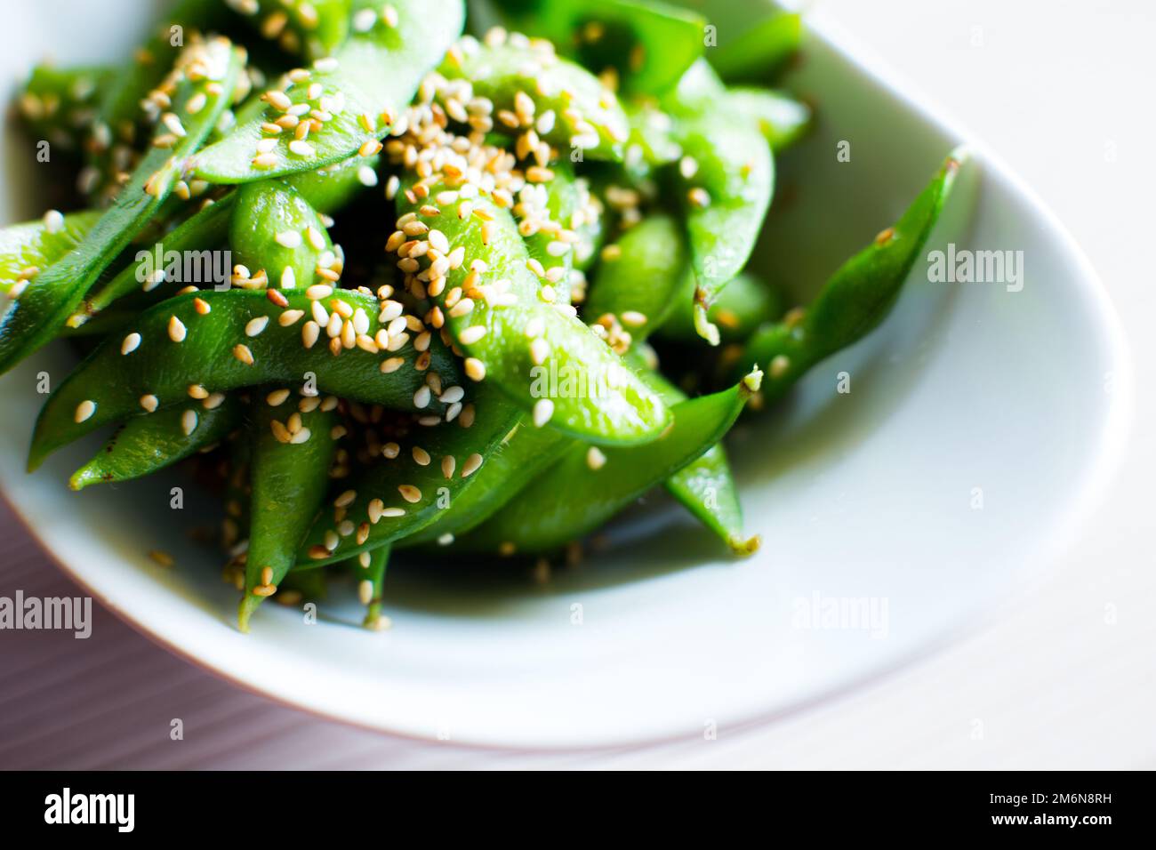 Edamame is a preparation of immature soybeans in the pod, found in ...