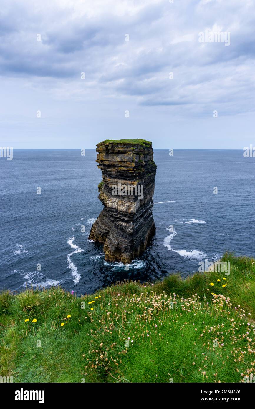 Vertical view of the landmark sea stack Downpatrick Head in County Mayo ...