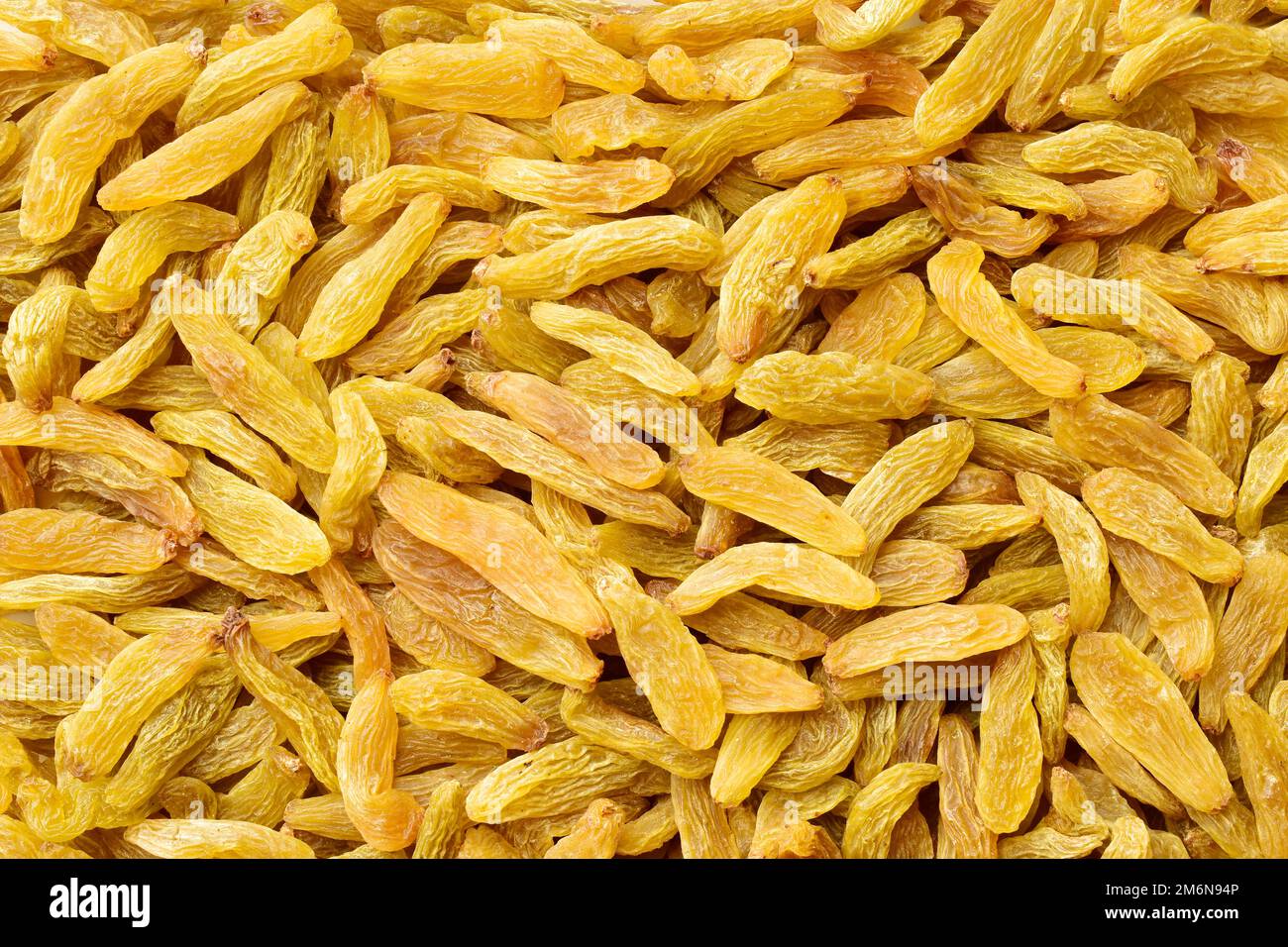 Yellow raisin texture top view dry grapes background Stock Photo - Alamy