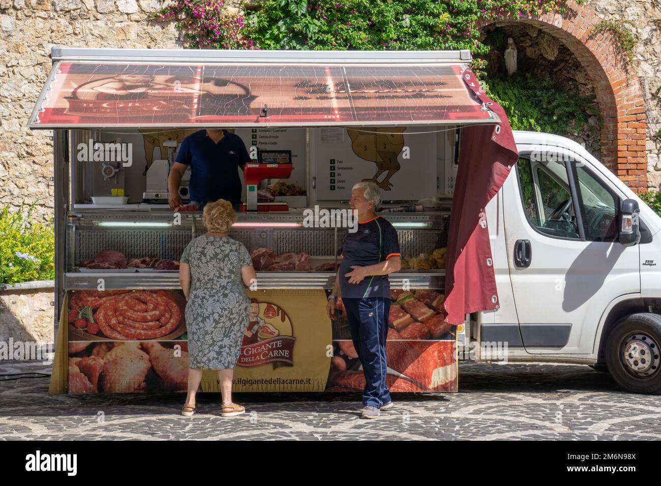 A street vendor of meat in the main square of Falvaterra, Lazio, Italy ...