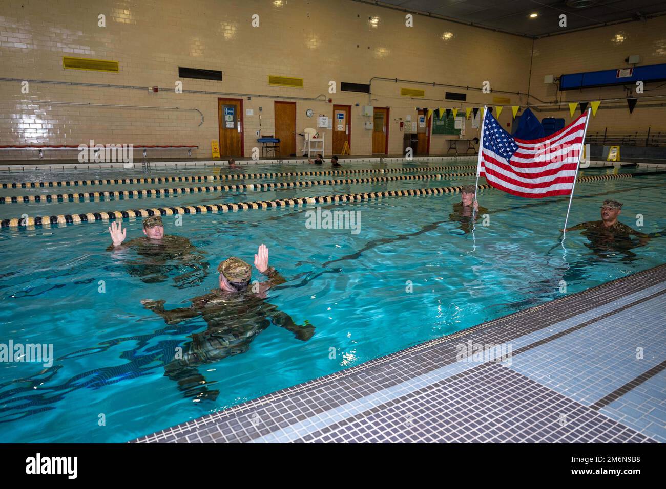 Lt. Col. Dylan W. Malcomb administers the oath of enlistment to Staff ...