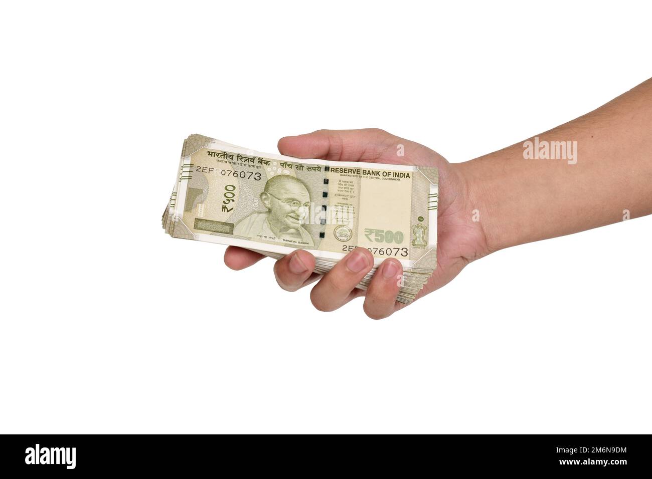 Indian currency bundle in hand isolated on white background Stock Photo ...