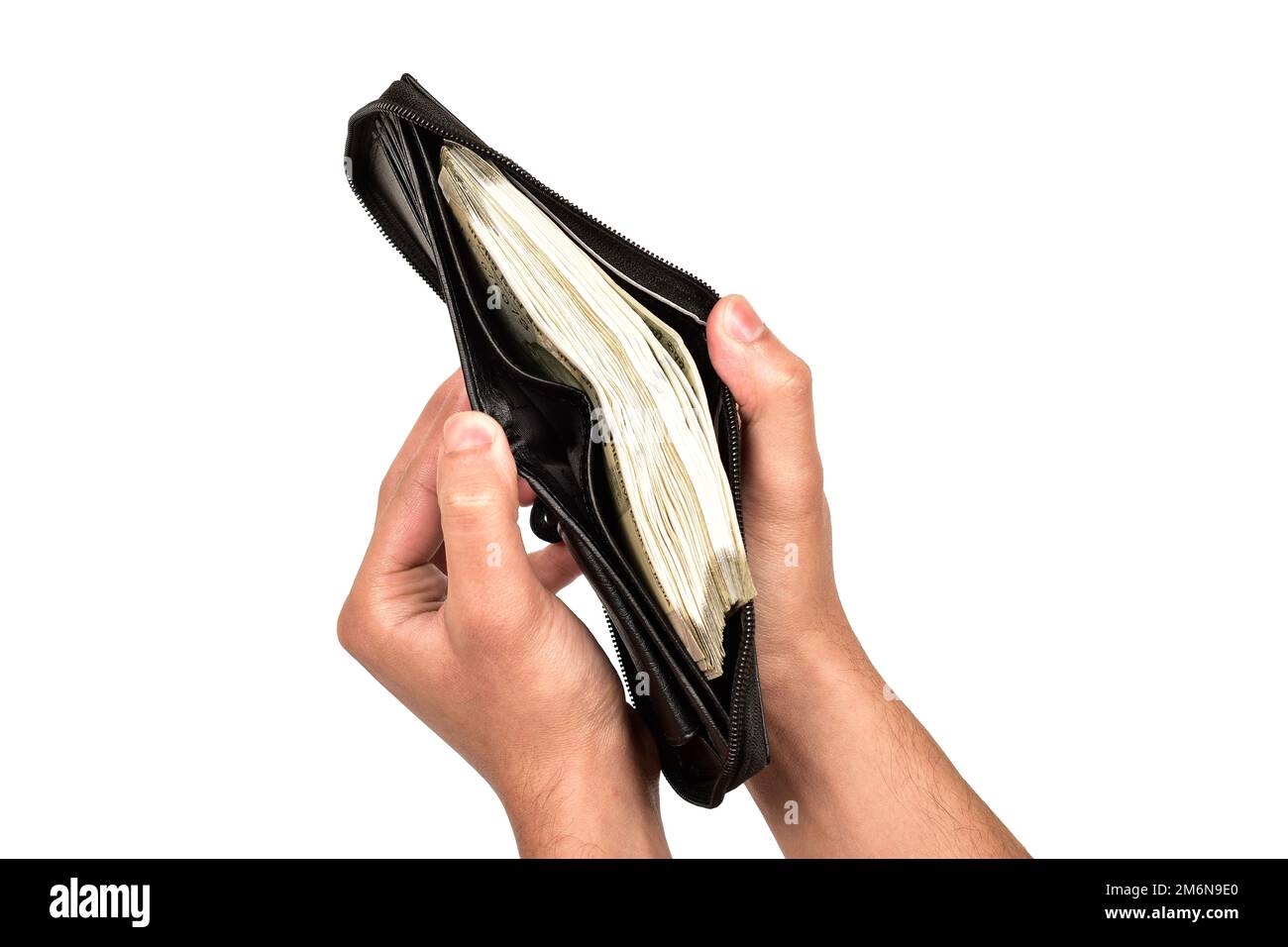 Hand holding cash in wallet isolated on white background with clipping ...