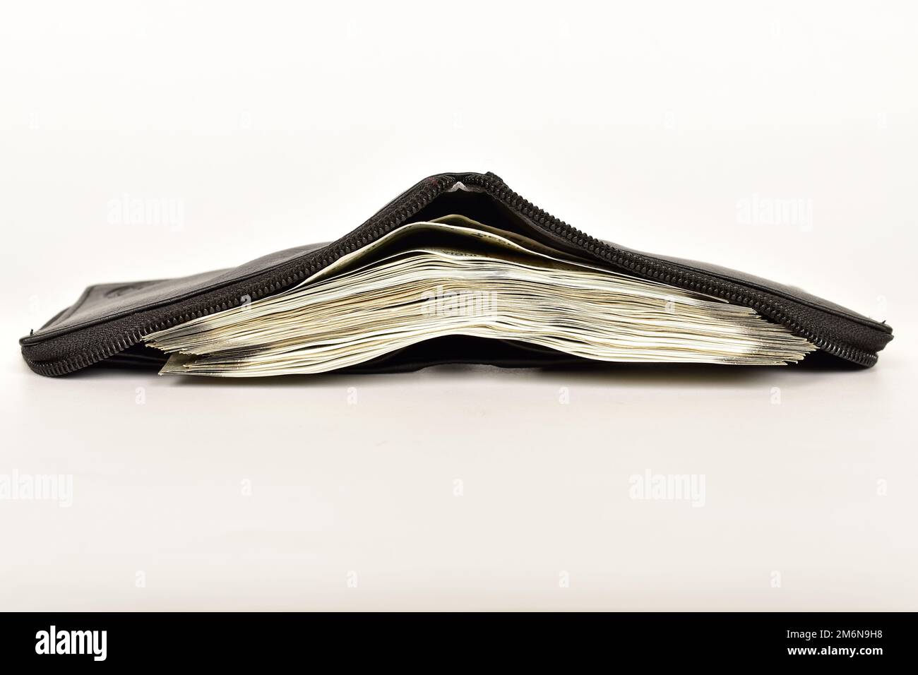 Cash in wallet isolated on white background Stock Photo - Alamy