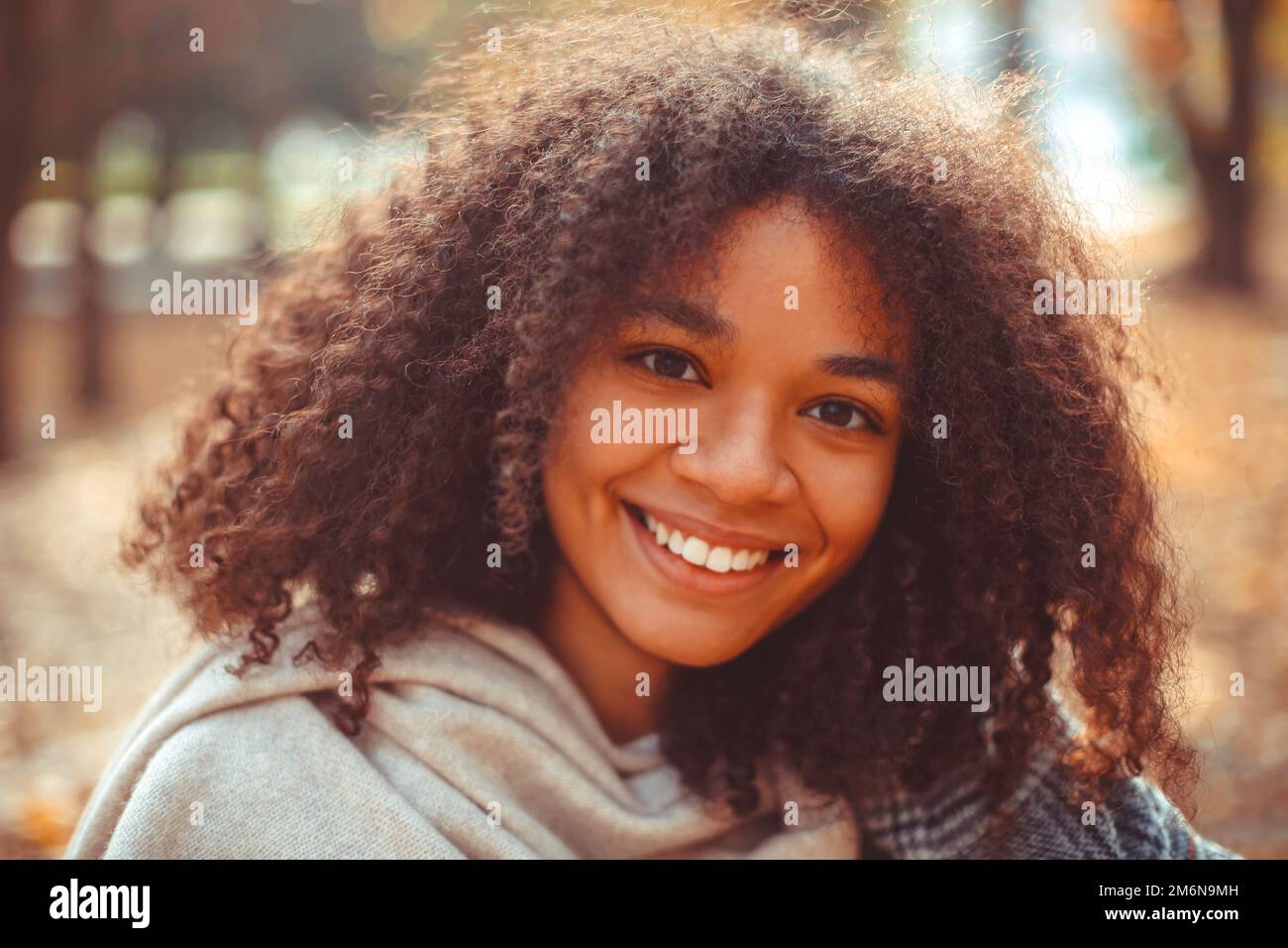 Cute autumn close up portrait of young smiling happy african american ...