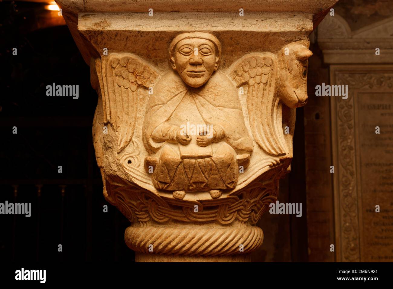 Winged man, symbol of Saint Matthew, detail of the capital in the crypt ...