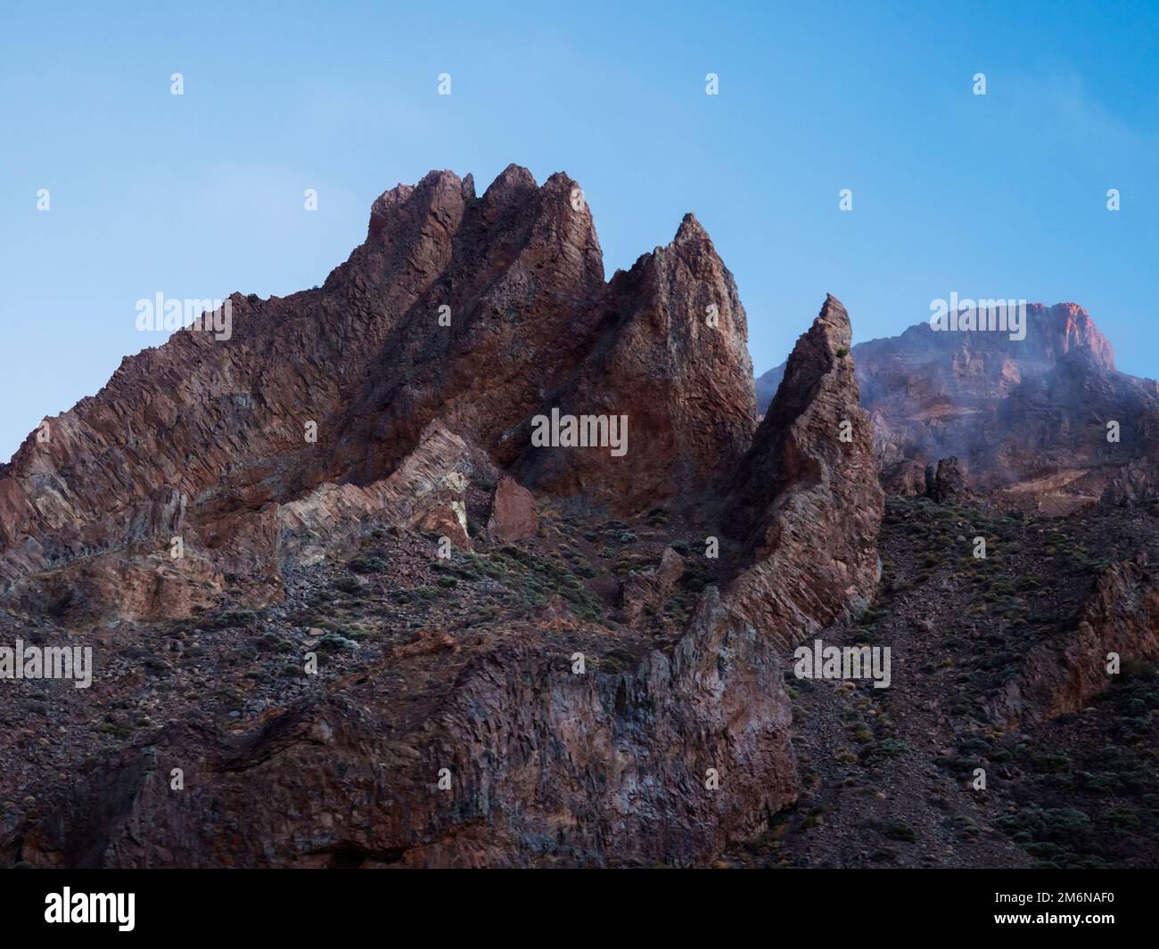 Red sunset light at Roques de Garcia volcanic rock formation at El Teide national park, Tenerife ...