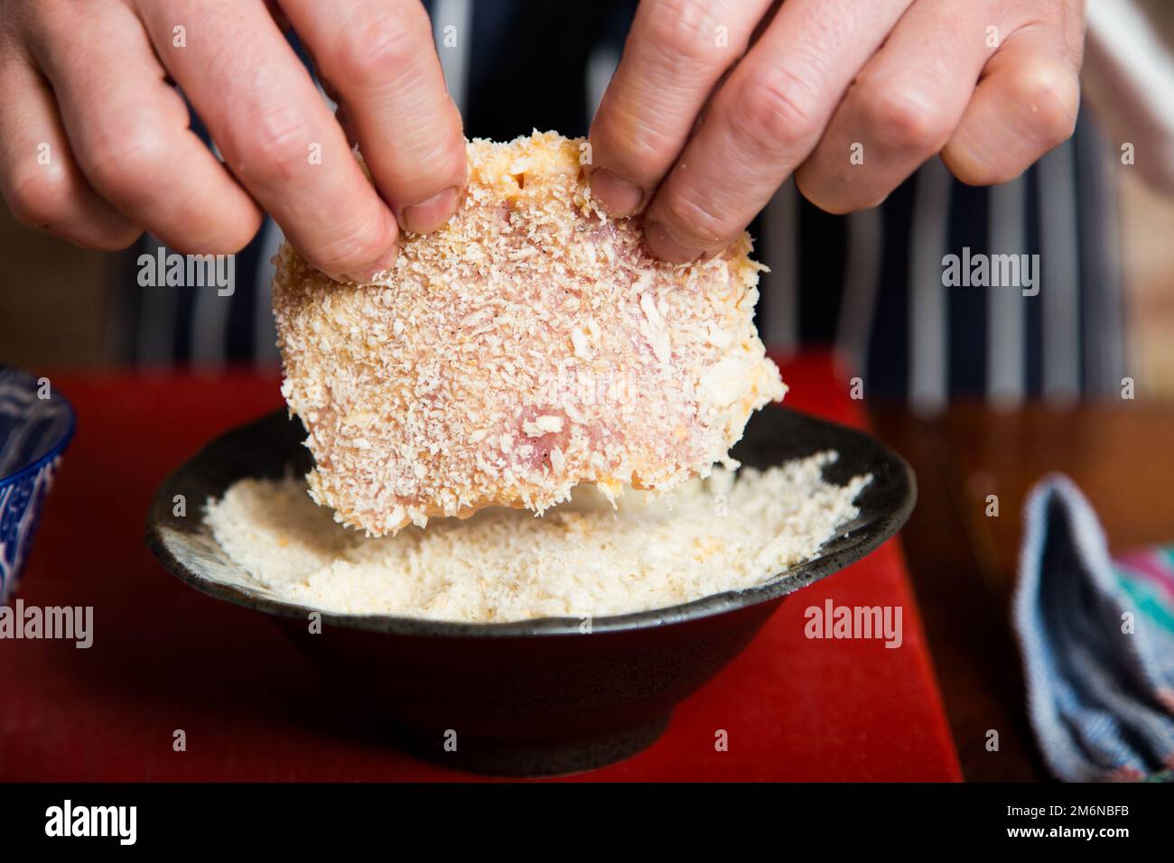 Preparing a pork loin for a Tonkatsu recipe in Japan Stock Photo - Alamy