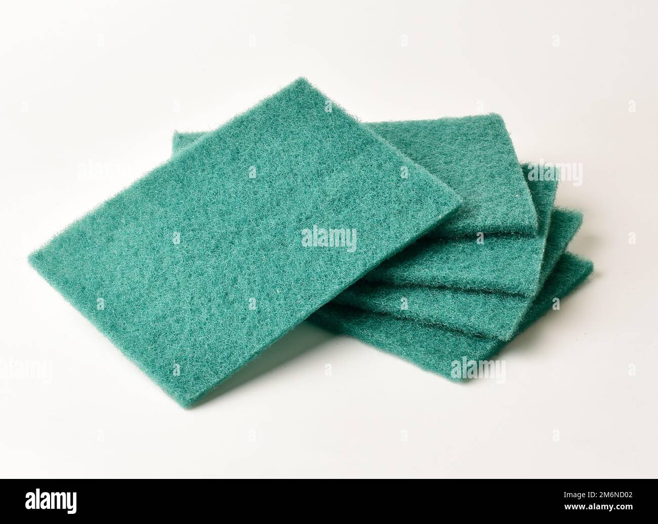 Pad for cleaning and dishwashing on white background Stock Photo - Alamy