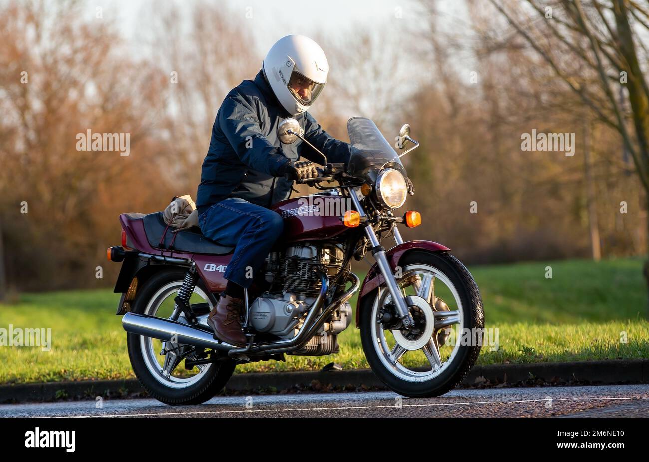 Man riding a Honda CB 400 motorcycle Stock Photo - Alamy