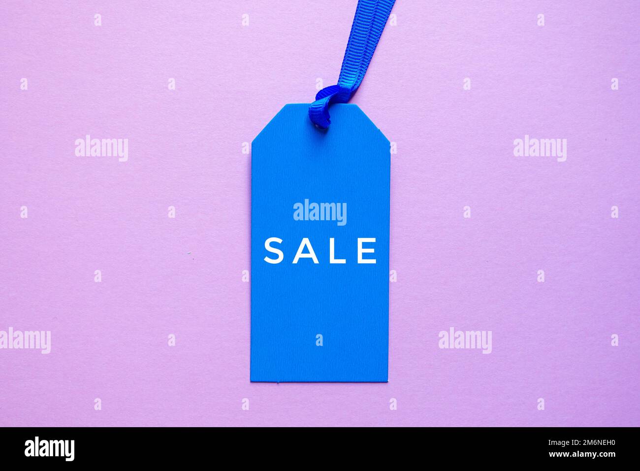 blue price tag with sale word on the pink background, blue mockup Stock ...