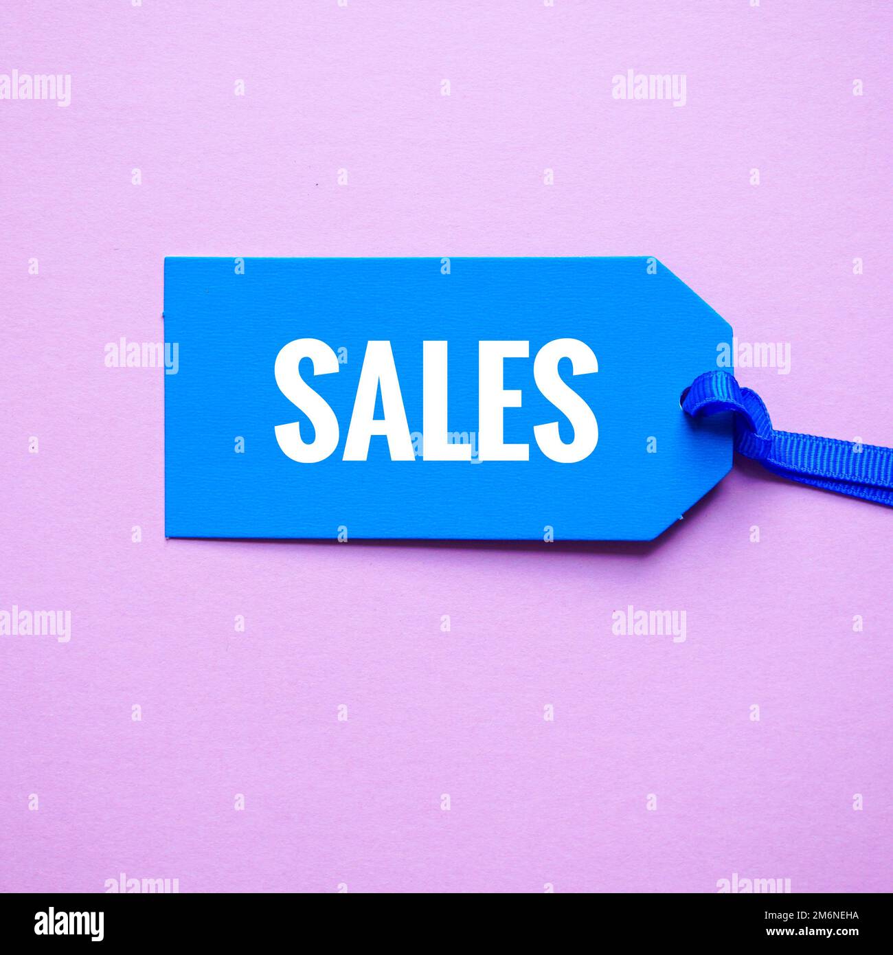 blue price tag with sale word on the pink background, blue mockup Stock ...