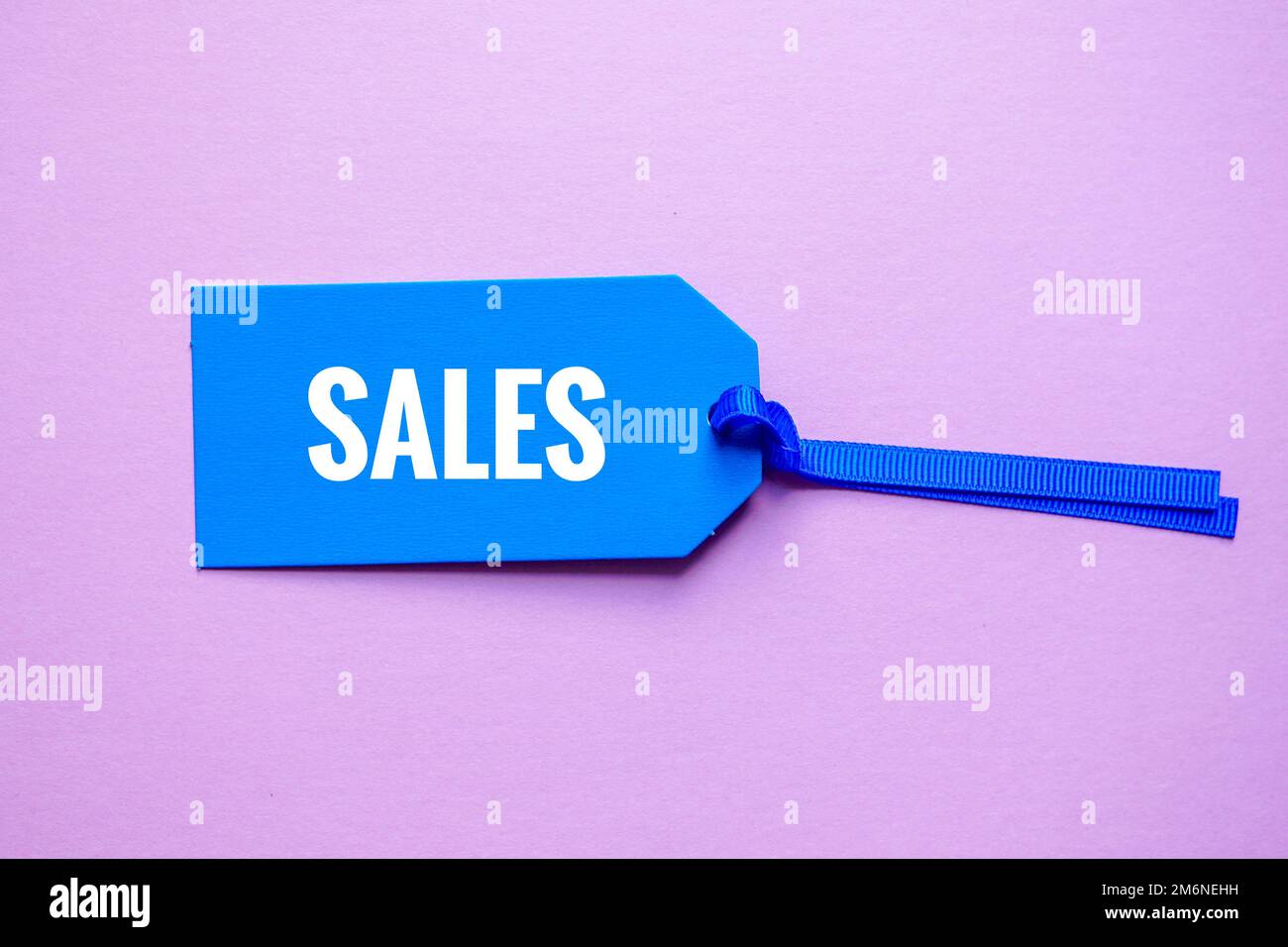 blue price tag with sale word on the pink background, blue mockup Stock ...