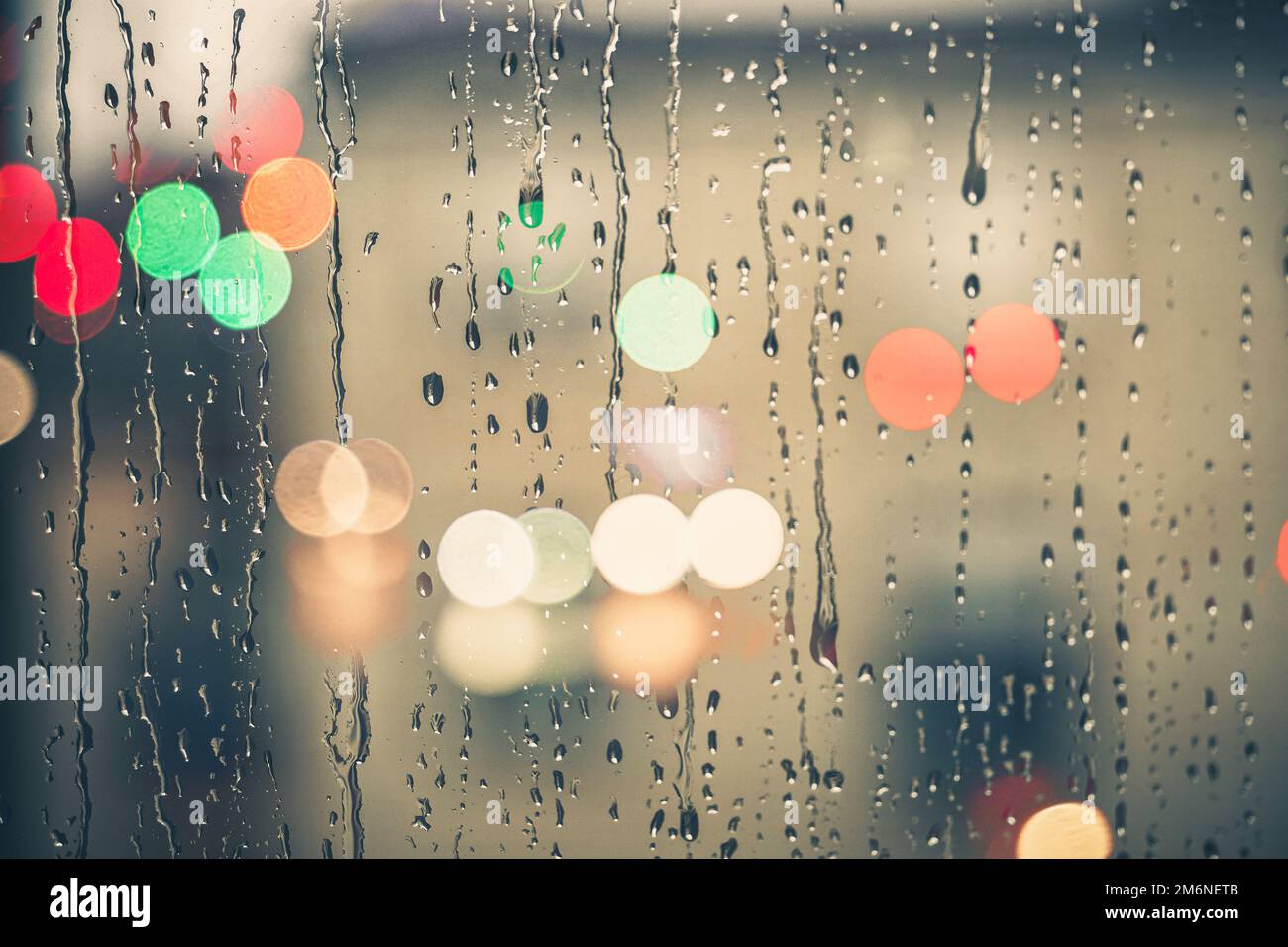 raindrops on the window and street lights background at night Stock ...