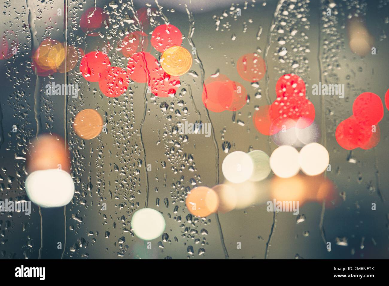 raindrops on the window and street lights background at night Stock ...