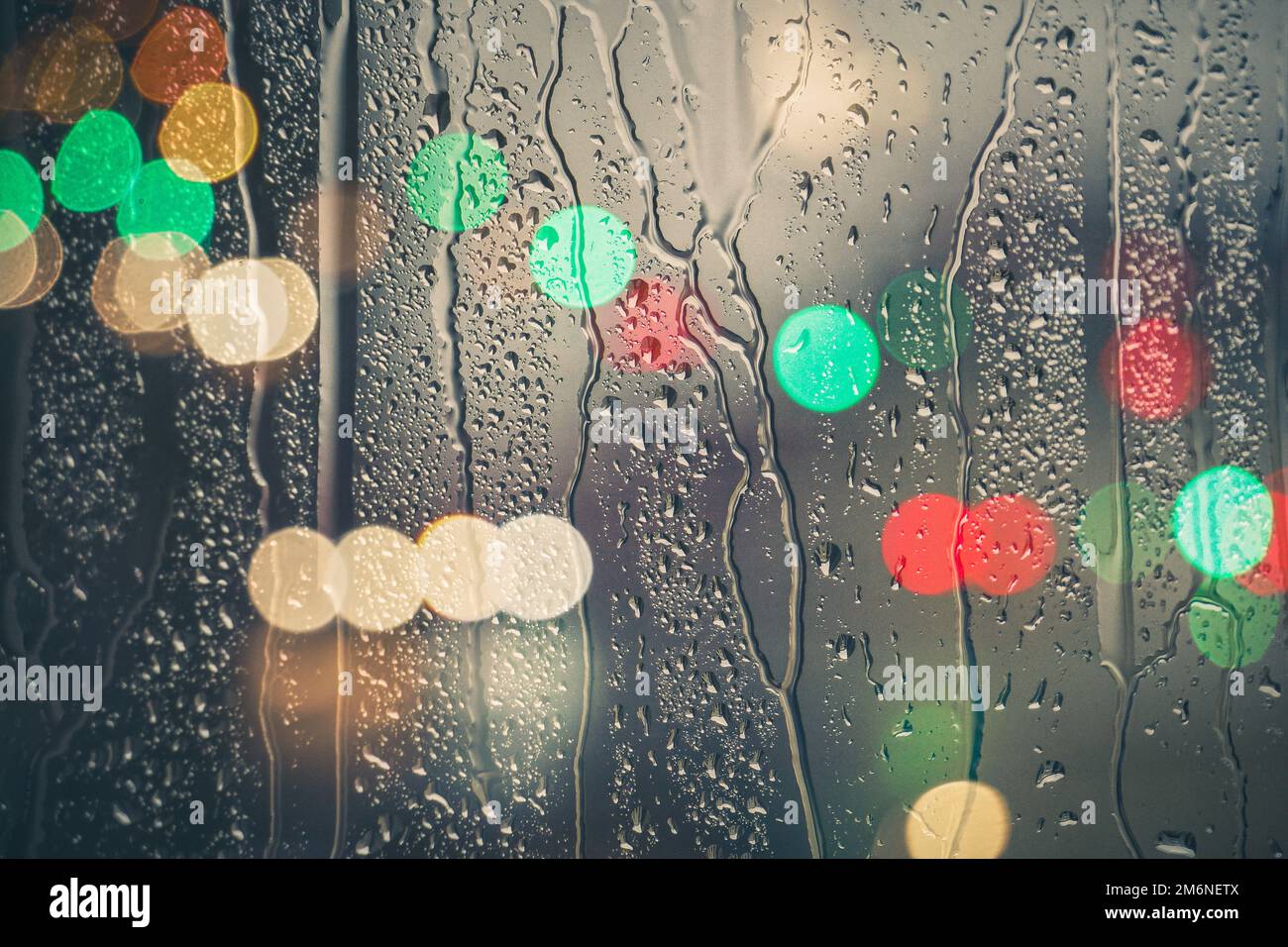 raindrops on the window and street lights background at night Stock ...