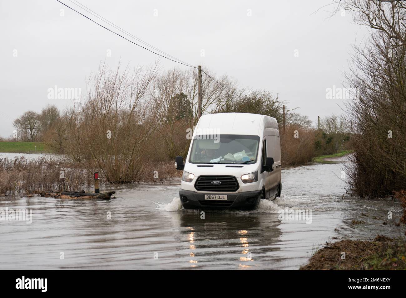 /A van drives along a flooded road in Sutton, Cambridgeshire, where the ...