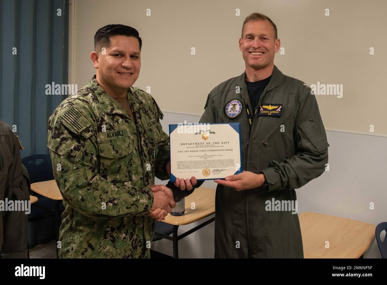 U.S. Navy Capt. Cassidy Norman, right, commanding officer of the ...