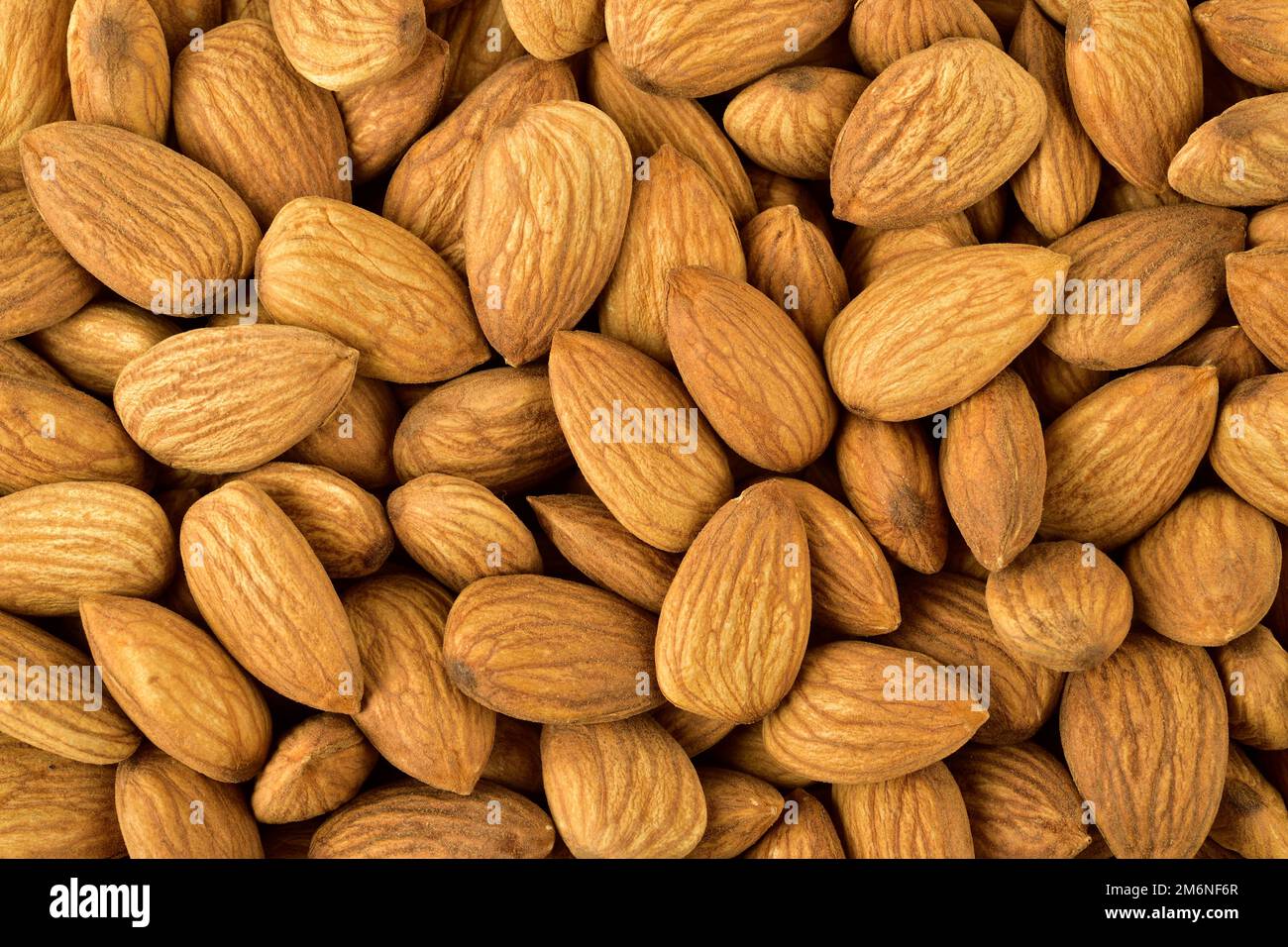 Almond texture with background Stock Photo - Alamy
