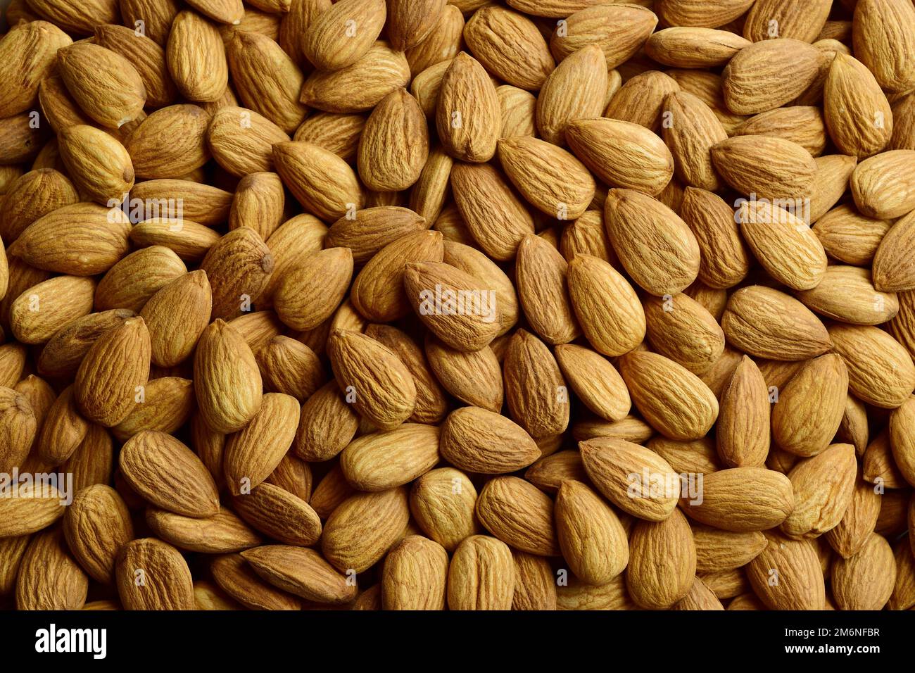 Top view of almond texture background Stock Photo - Alamy