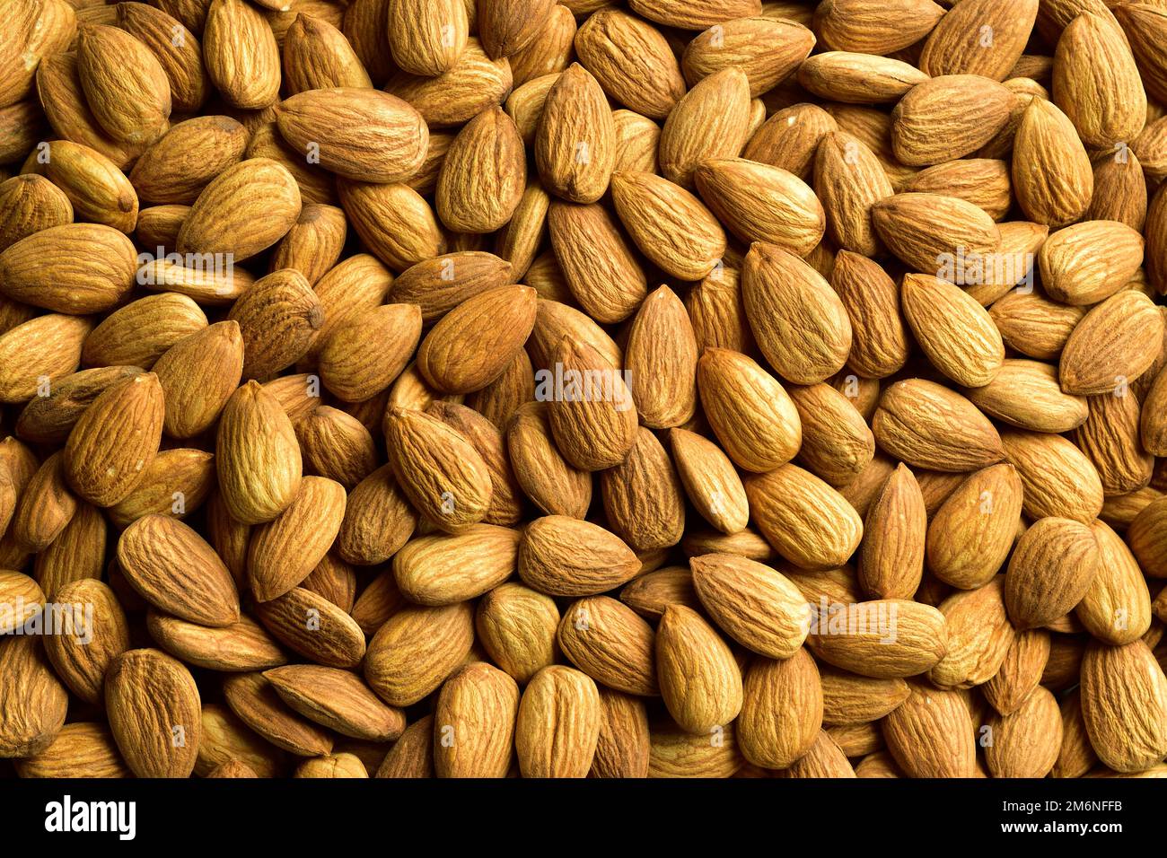 Dry almond texture background top view Stock Photo - Alamy