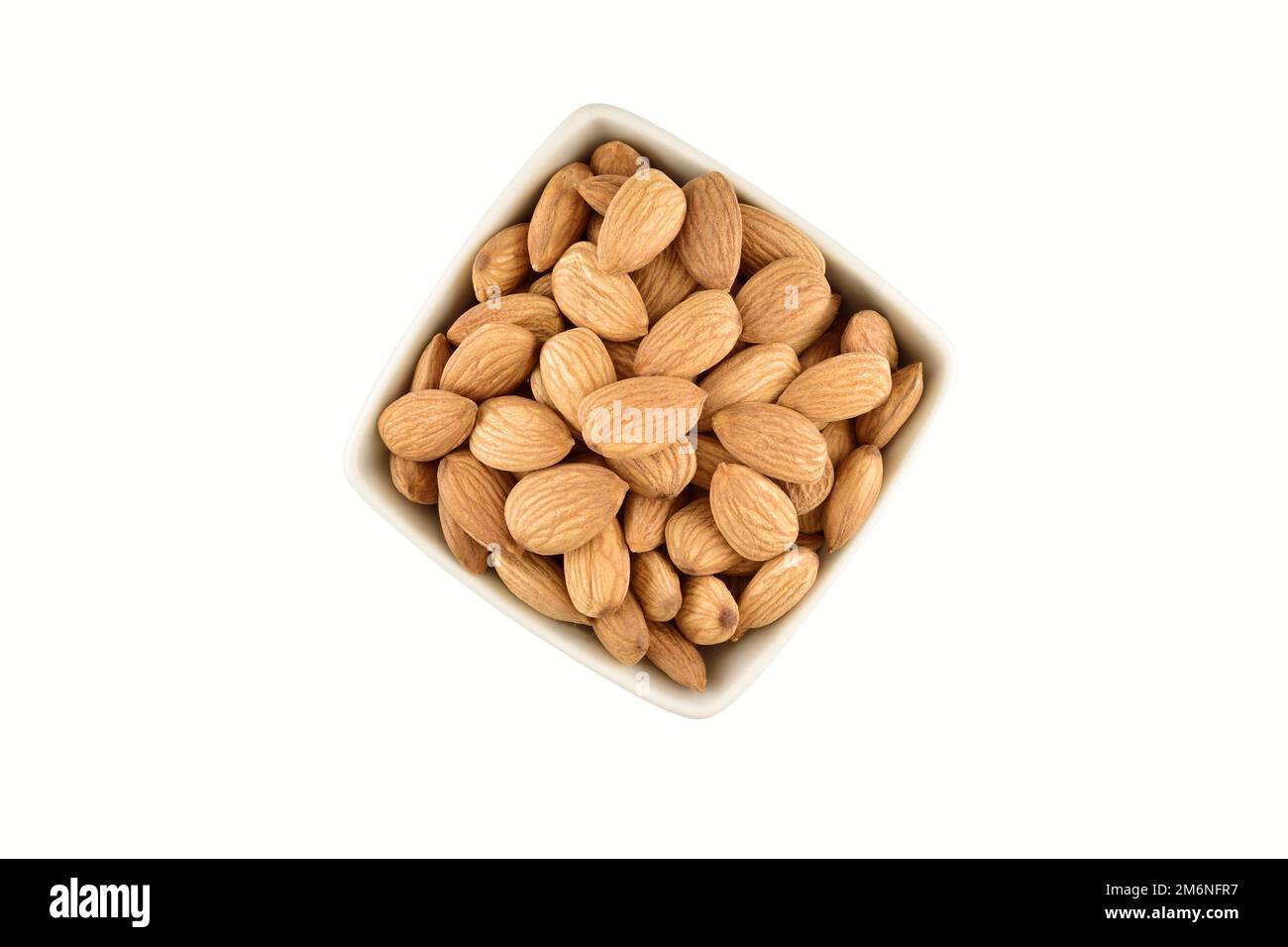 Top view of almond in bowl isolated on white background with clipping ...