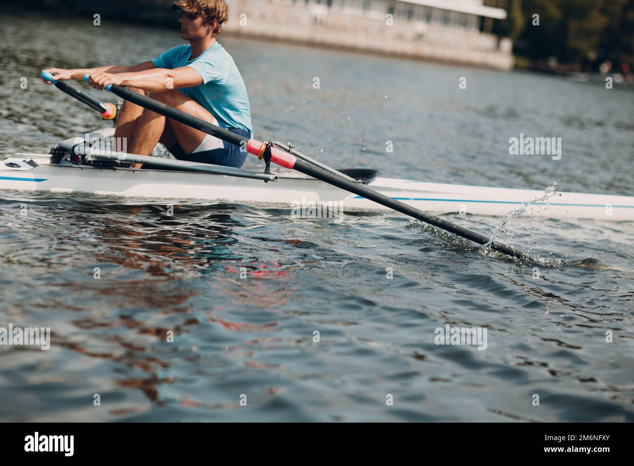 Sportsman single scull man rower rowing on boat Stock Photo - Alamy