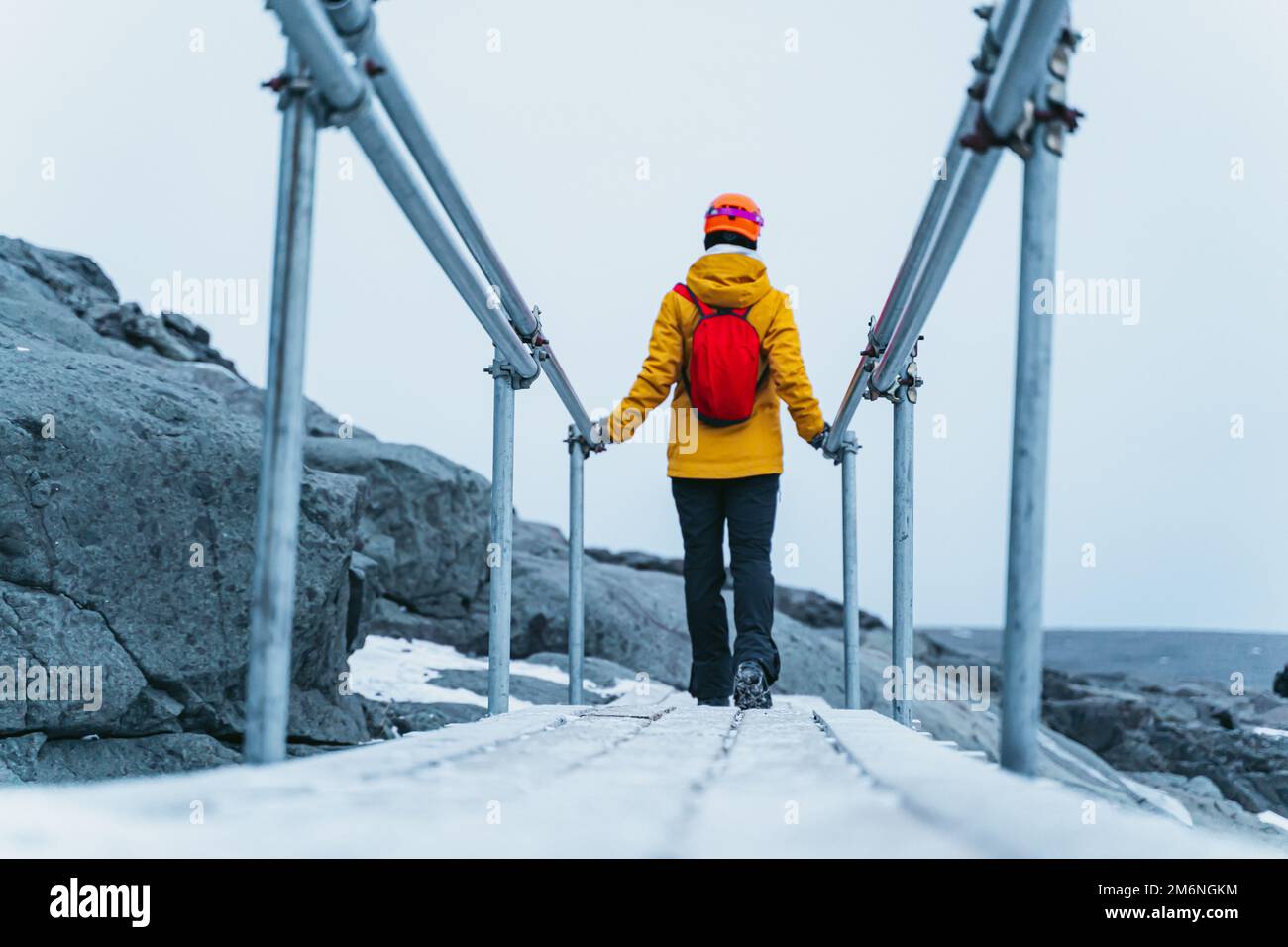 woman crossing an unstable wooden bridge Stock Photo - Alamy
