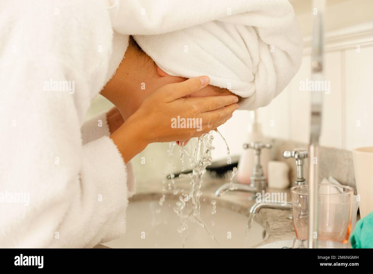 Woman wearing white bath robe hi-res stock photography and images - Alamy