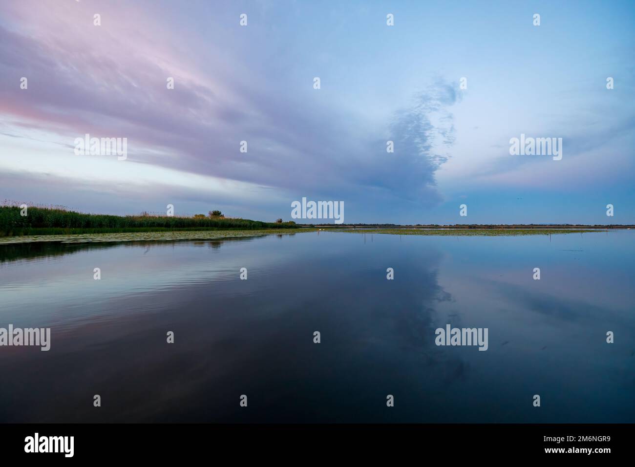 Sunrise with reflections in the Danube Delta in Romania Stock Photo - Alamy