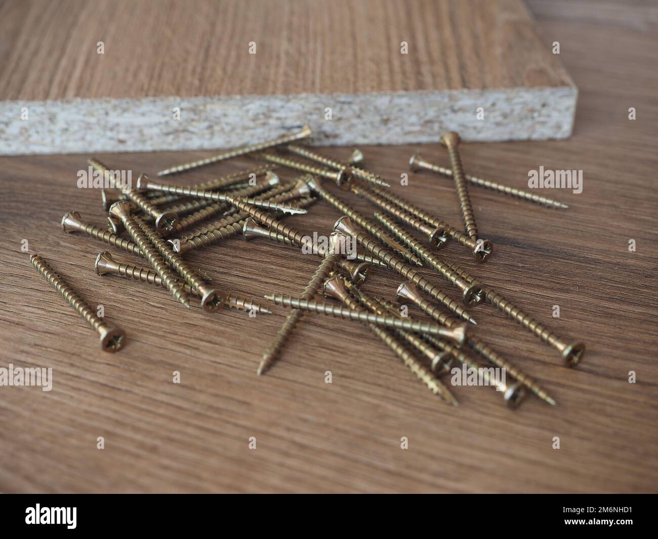 wood screws on melamine manufactured wood panel Stock Photo - Alamy
