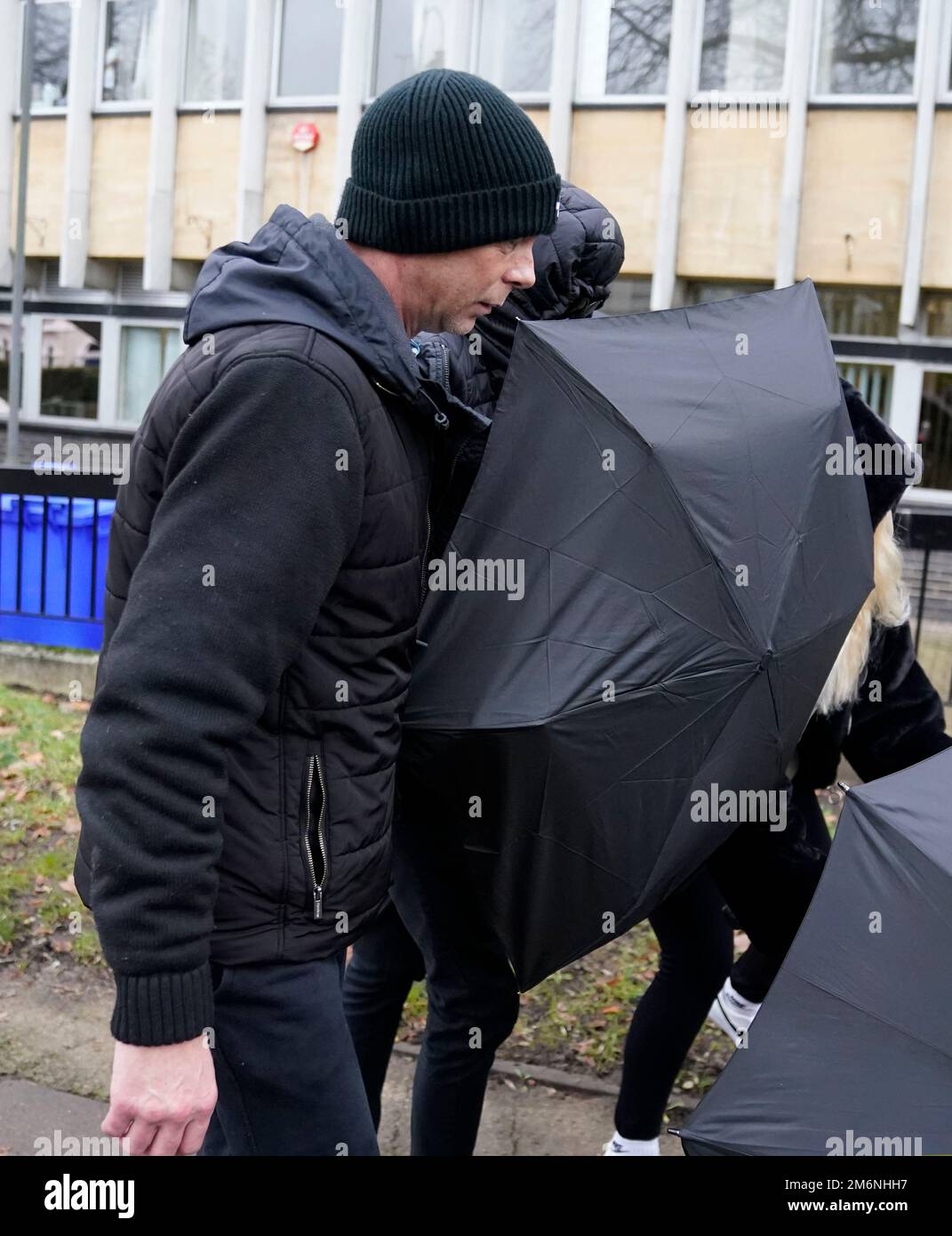 Elliot Benham, 23, (right, under umbrella) leaves Cheltenham ...