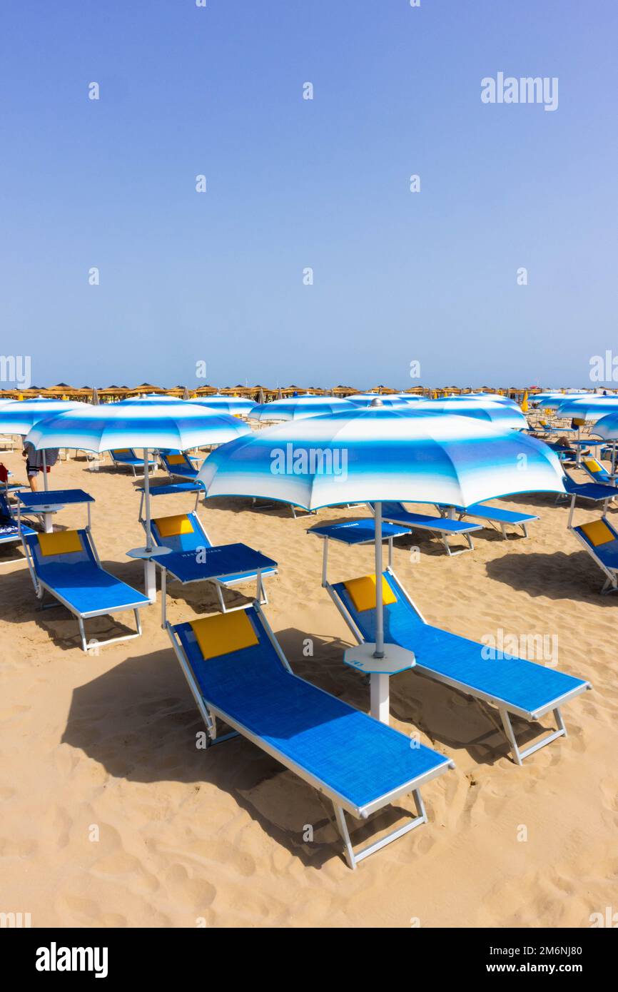 Traditional beach chair and umbrella. Rimini, Italy Stock Photo - Alamy