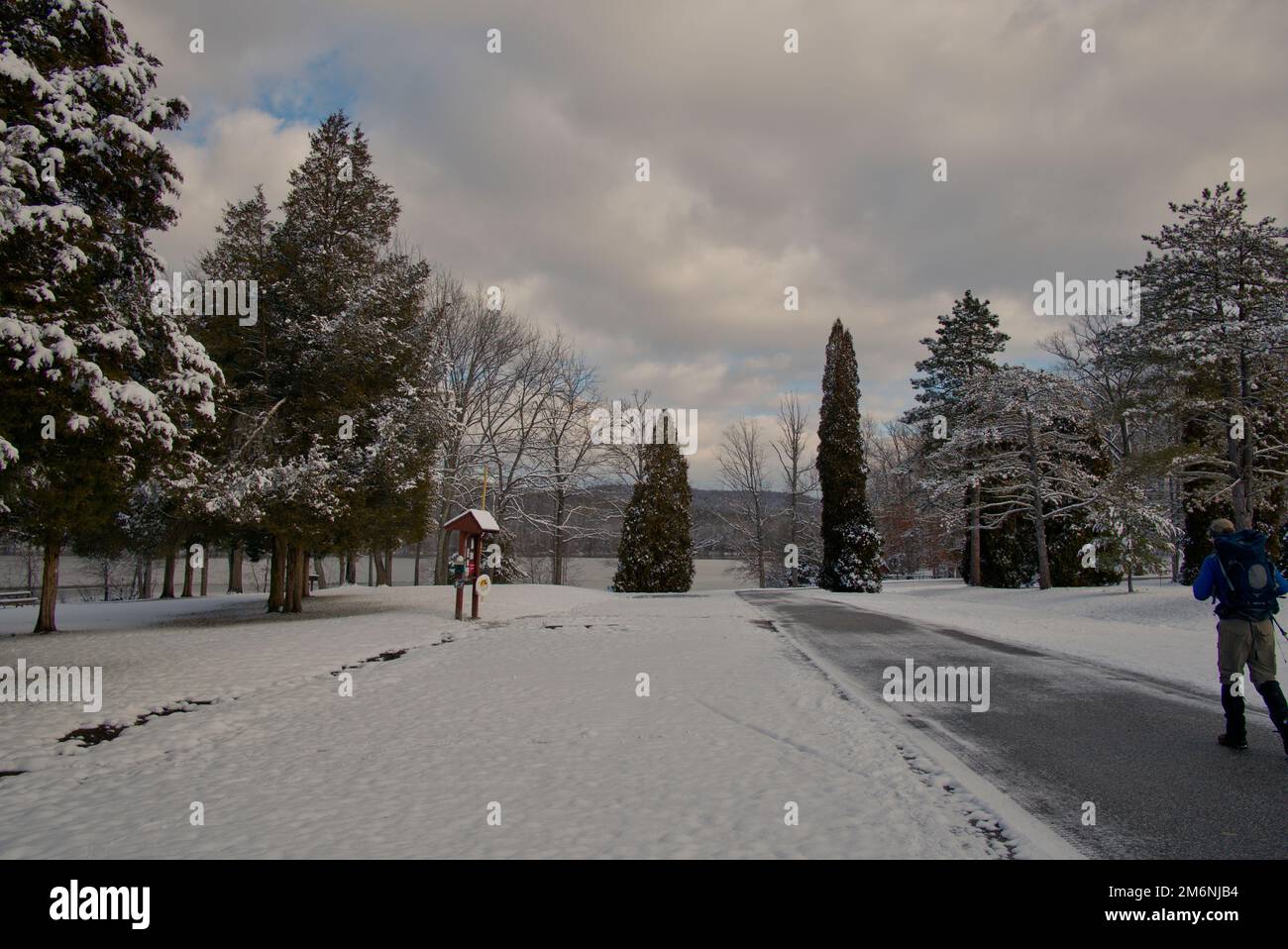 A hiker traverses a frozen walkway Stock Photo - Alamy