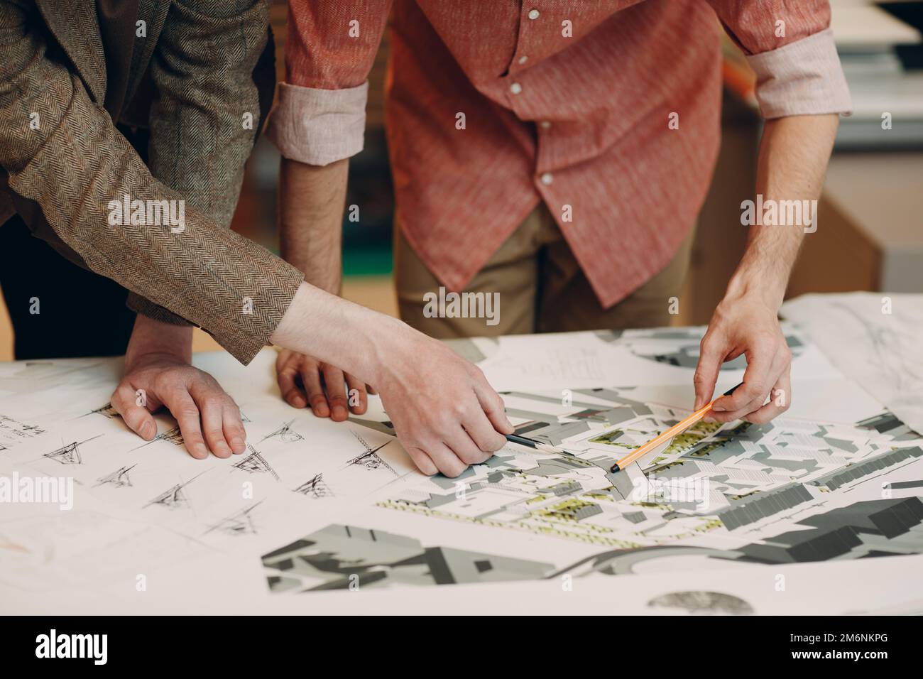 Architect with blueprints and layout design project at office Stock ...