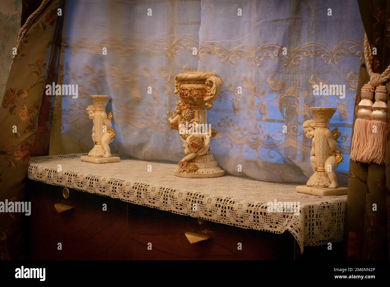 An interior of room with statues on shelf Stock Photo - Alamy